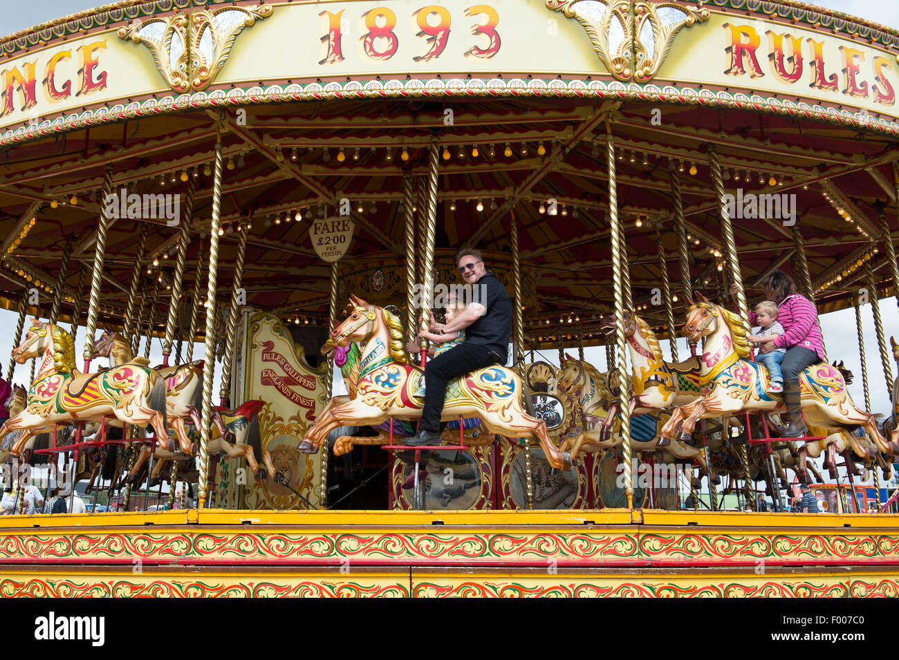 Steam Galloping horse carousel, fairground ride at a steam fair ...