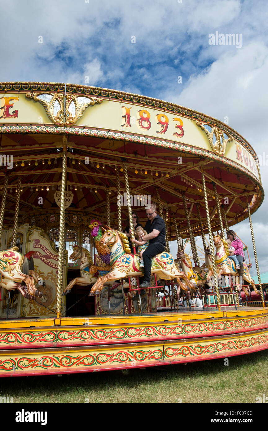 Steam Galloping horse carousel, fairground ride at a steam fair ...