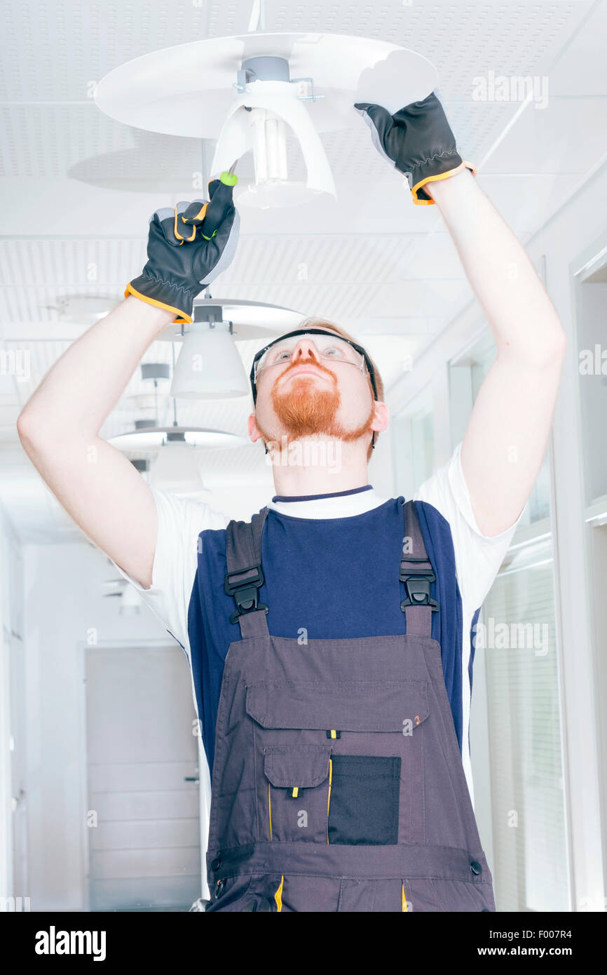 Light bulb change man hi-res stock photography and images - Alamy