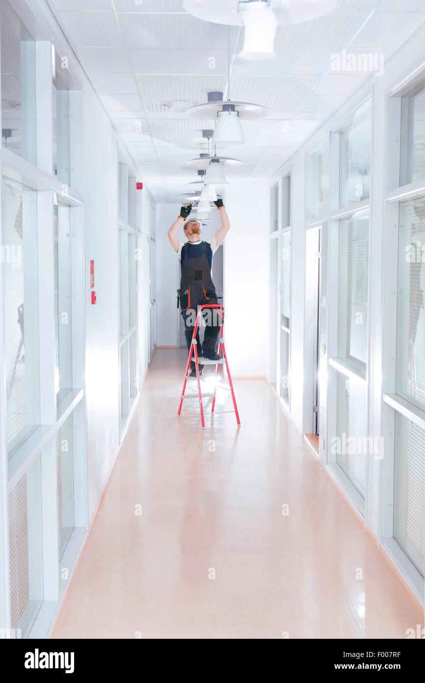 Man on Ladder Stock Photo - Alamy
