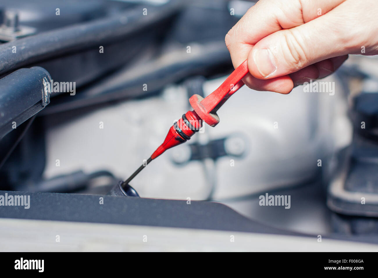 Inspecting car oil hi-res stock photography and images - Alamy