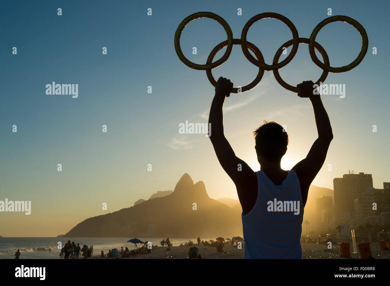 RIO DE JANEIRO, BRAZIL - MARCH 05, 2015: Athlete holds Olympic rings ...