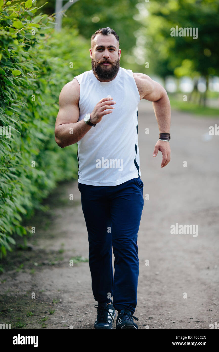 bearded man runs Stock Photo - Alamy