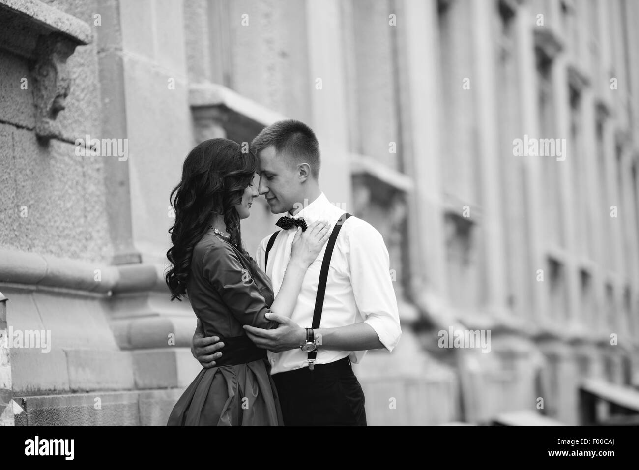 European beautiful couple posing on the street Stock Photo - Alamy
