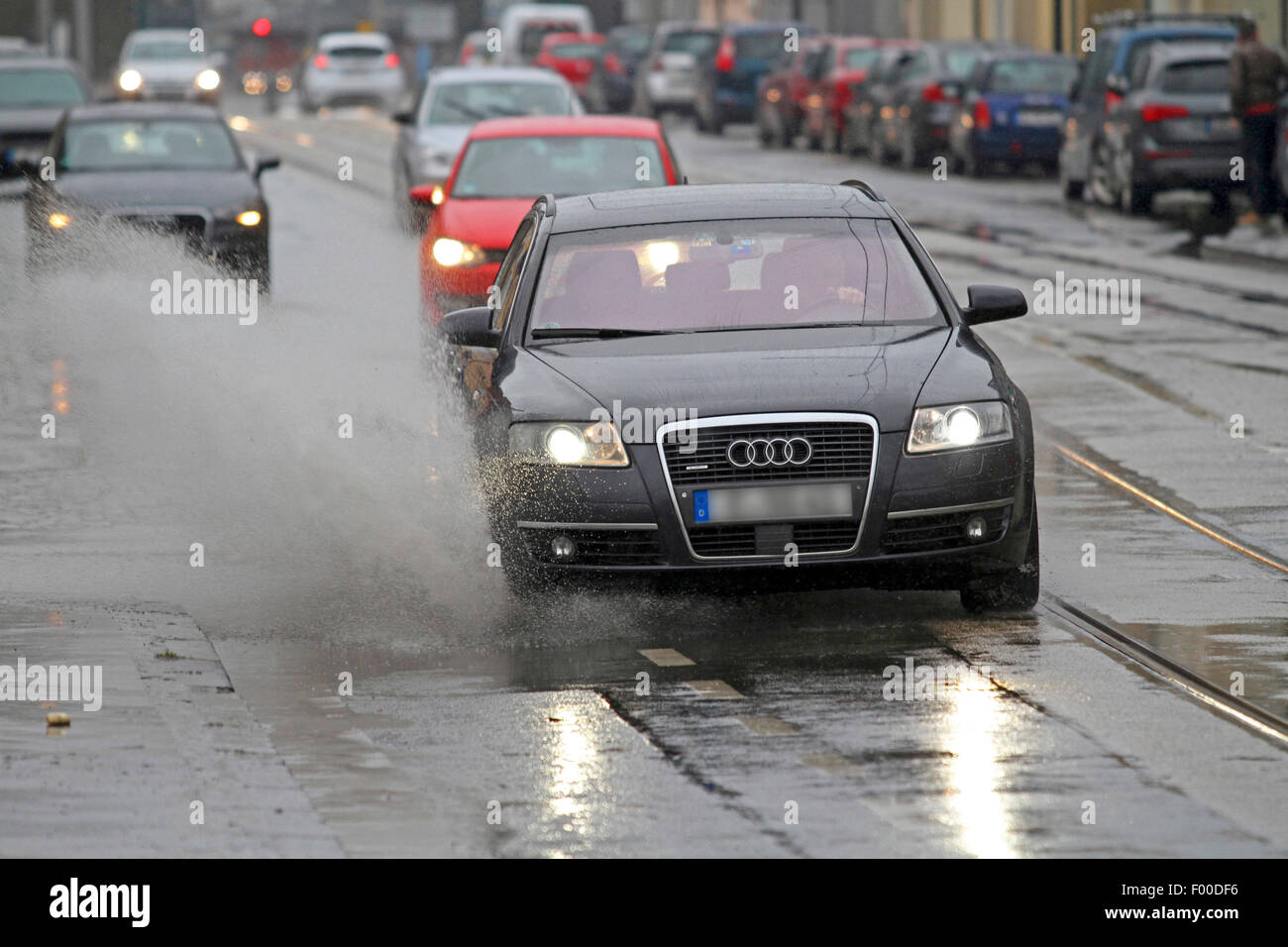 car splashing through a puddle, Germany Stock Photo - Alamy