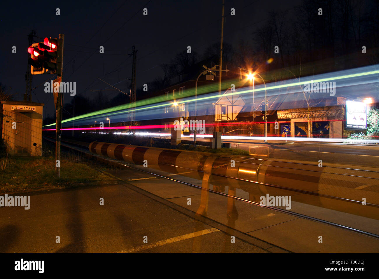 train crossing an railway crossing at night, Germany Stock Photo - Alamy