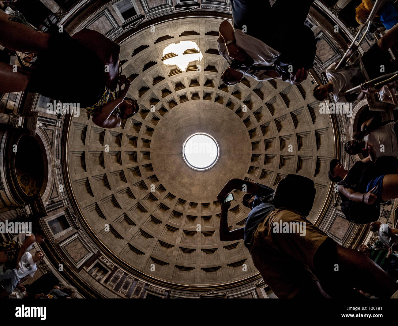 Tourists taking photos of Oculus interior. The Pantheon. Ancient Roman ...