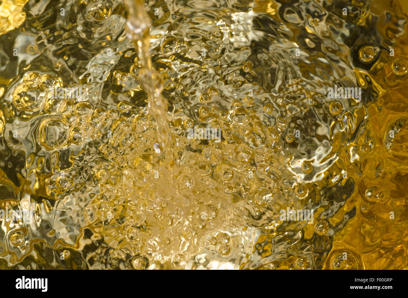 golden water background selective focus Stock Photo - Alamy
