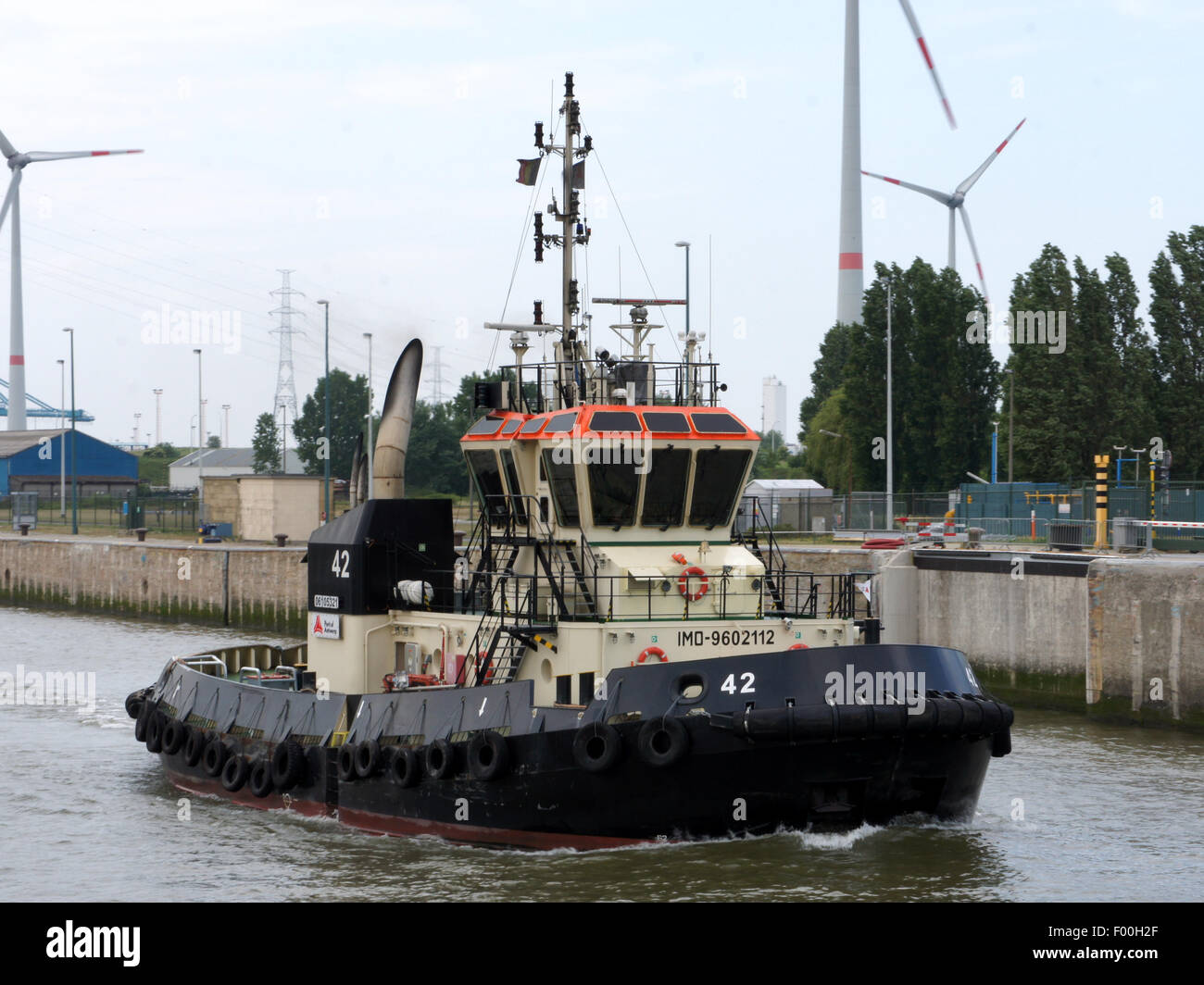 Tug 42 (IMO 9602112) is operating in the Port of Antwerp, assisting ...