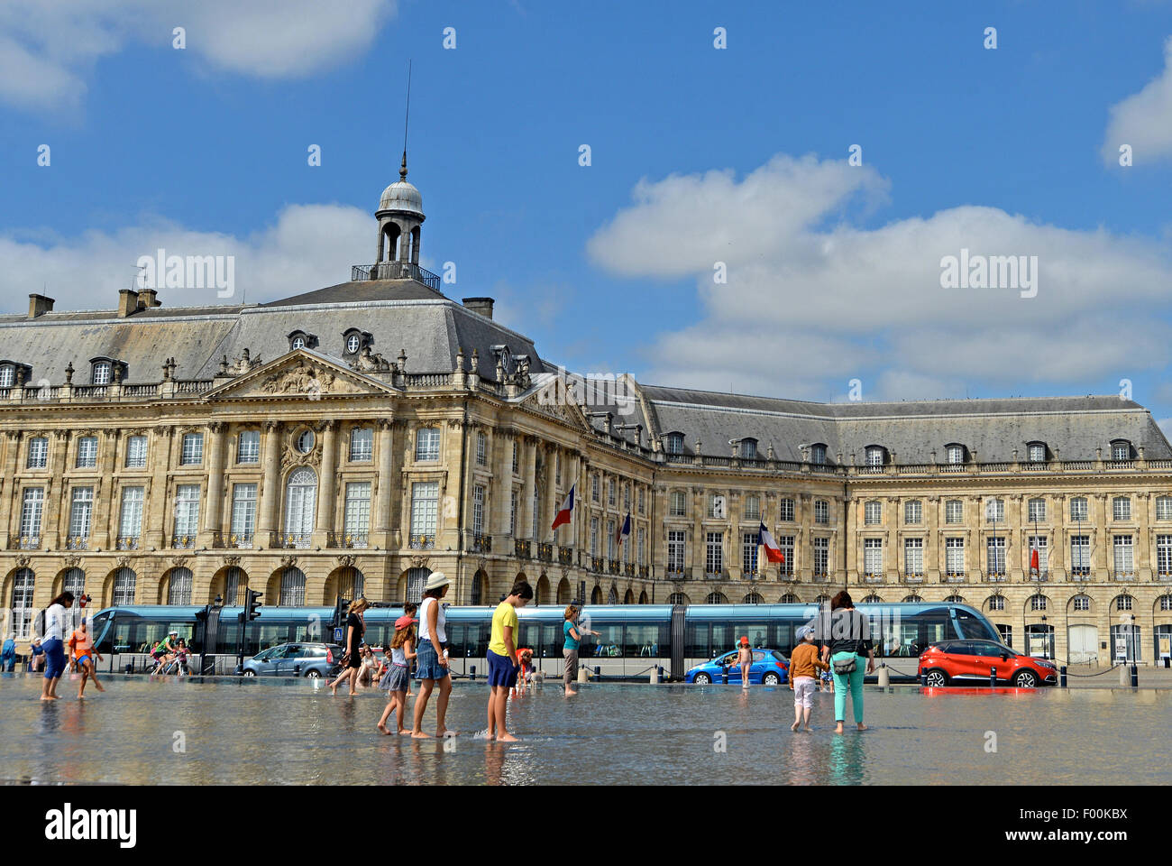 Tram before the water mirror Bourse square Bordeaux Gironde Aquitaine ...