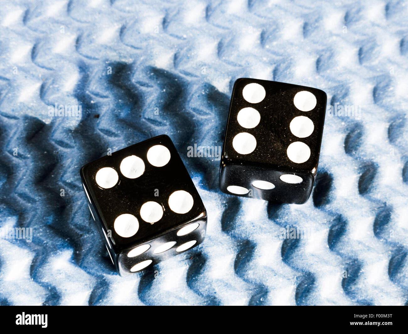 Pair of Black Dice on Blue Textured Background Stock Photo - Alamy