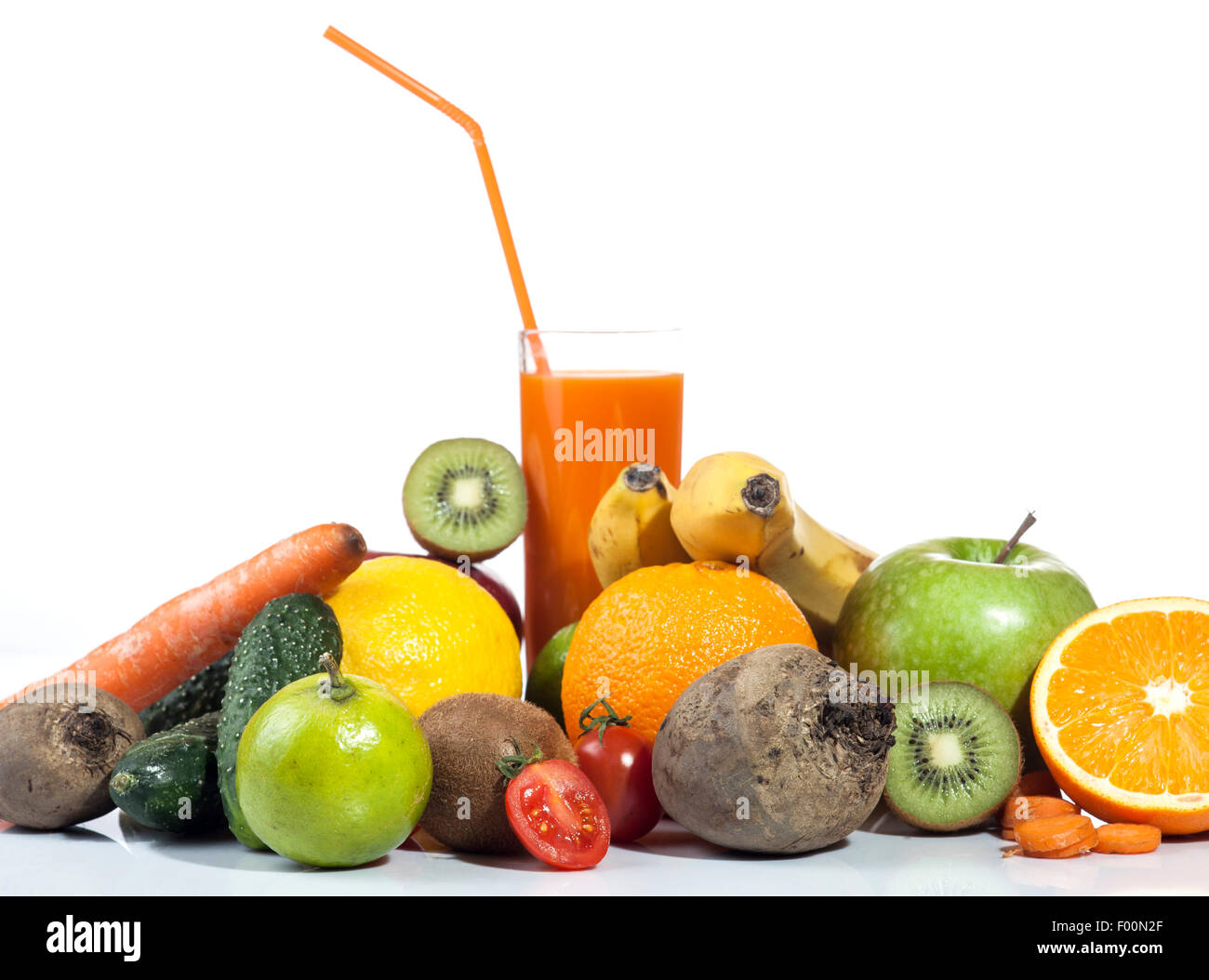 Fresh juice with colorful fruits and vegetables isolated on white ...