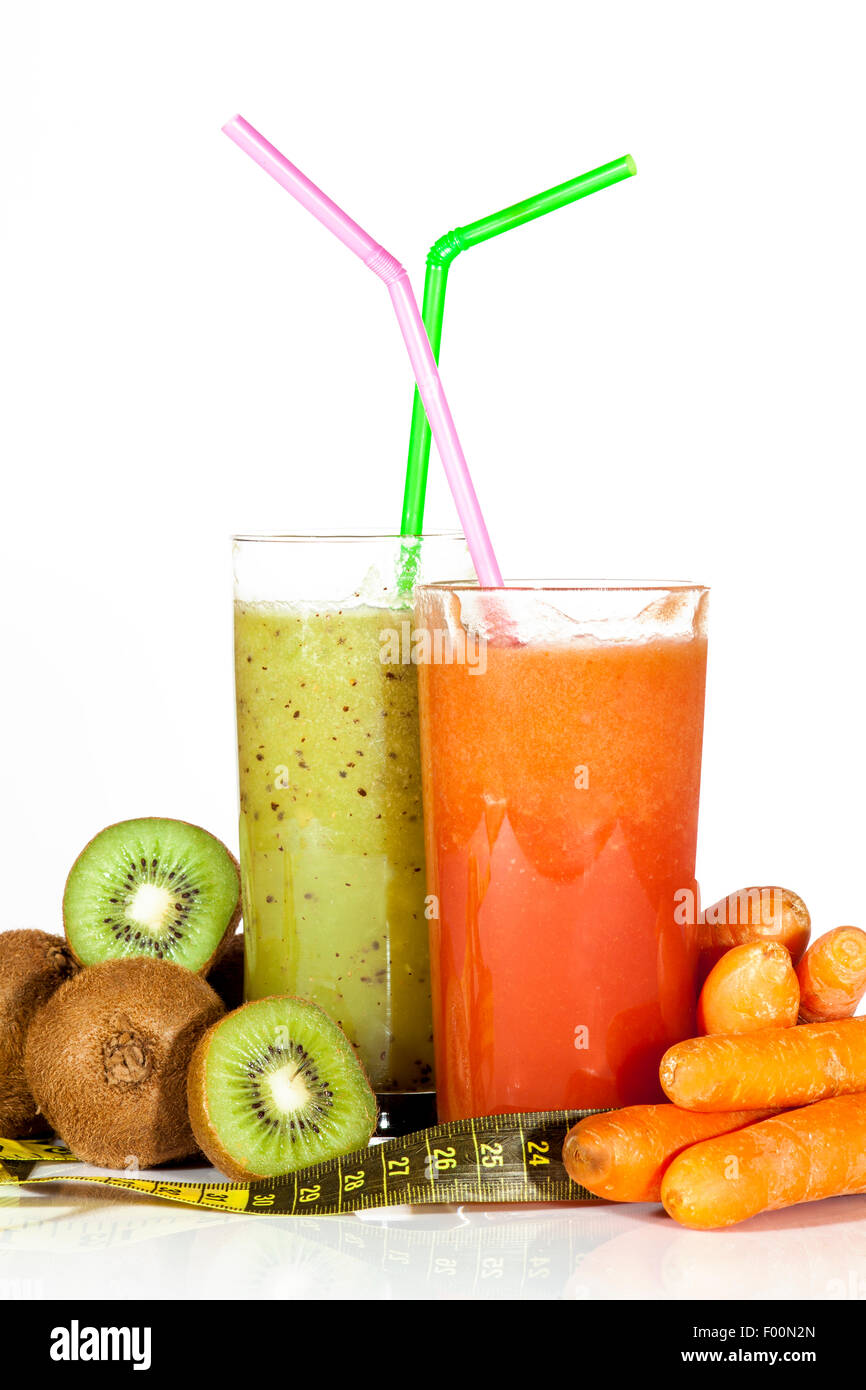 Fresh juice with colorful fruits and vegetables isolated on white ...