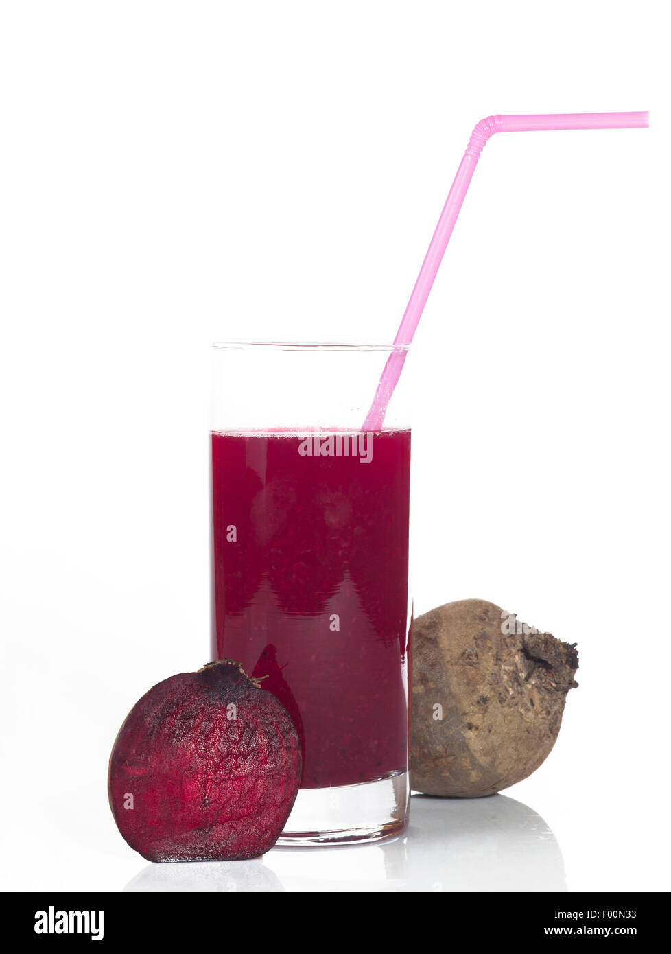 Fresh beetroot juice with whole vegetables isolated on white background ...