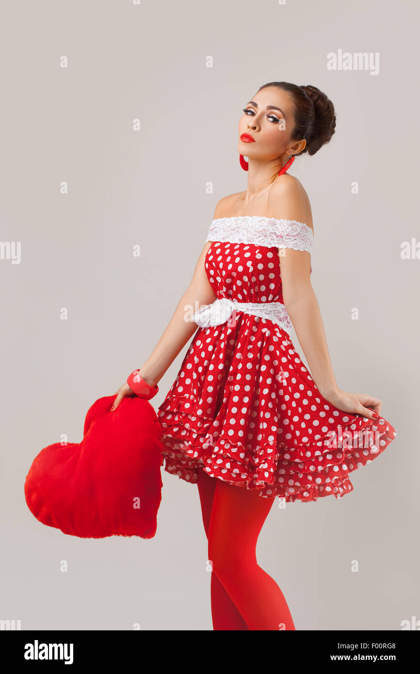 Beautiful woman with heart. Pin-Up Retro Style Stock Photo - Alamy