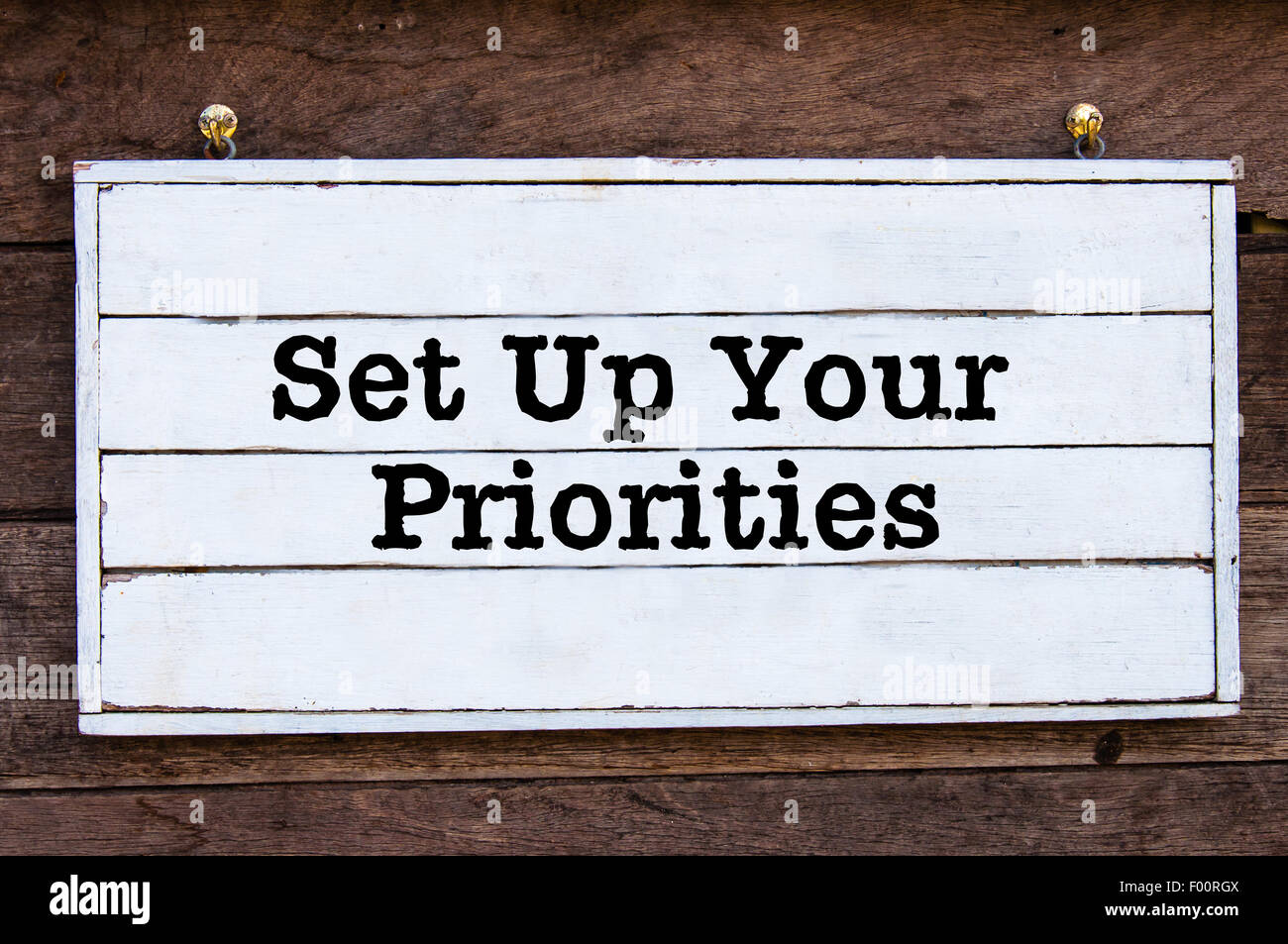 Set Up Your Priorities Inspirational message written on vintage wooden ...