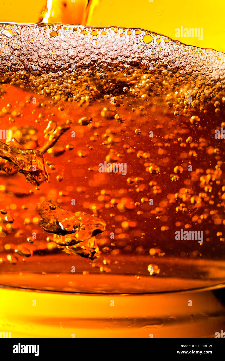 detail of an alcoholic beverage on yellow background Stock Photo - Alamy