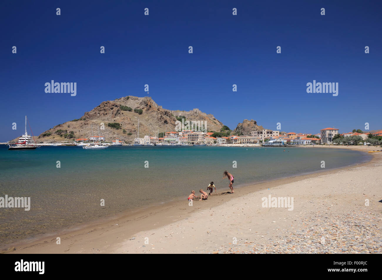 Kids playing at Tourkikos beach, Myrina city. Lemnos or limnos island ...