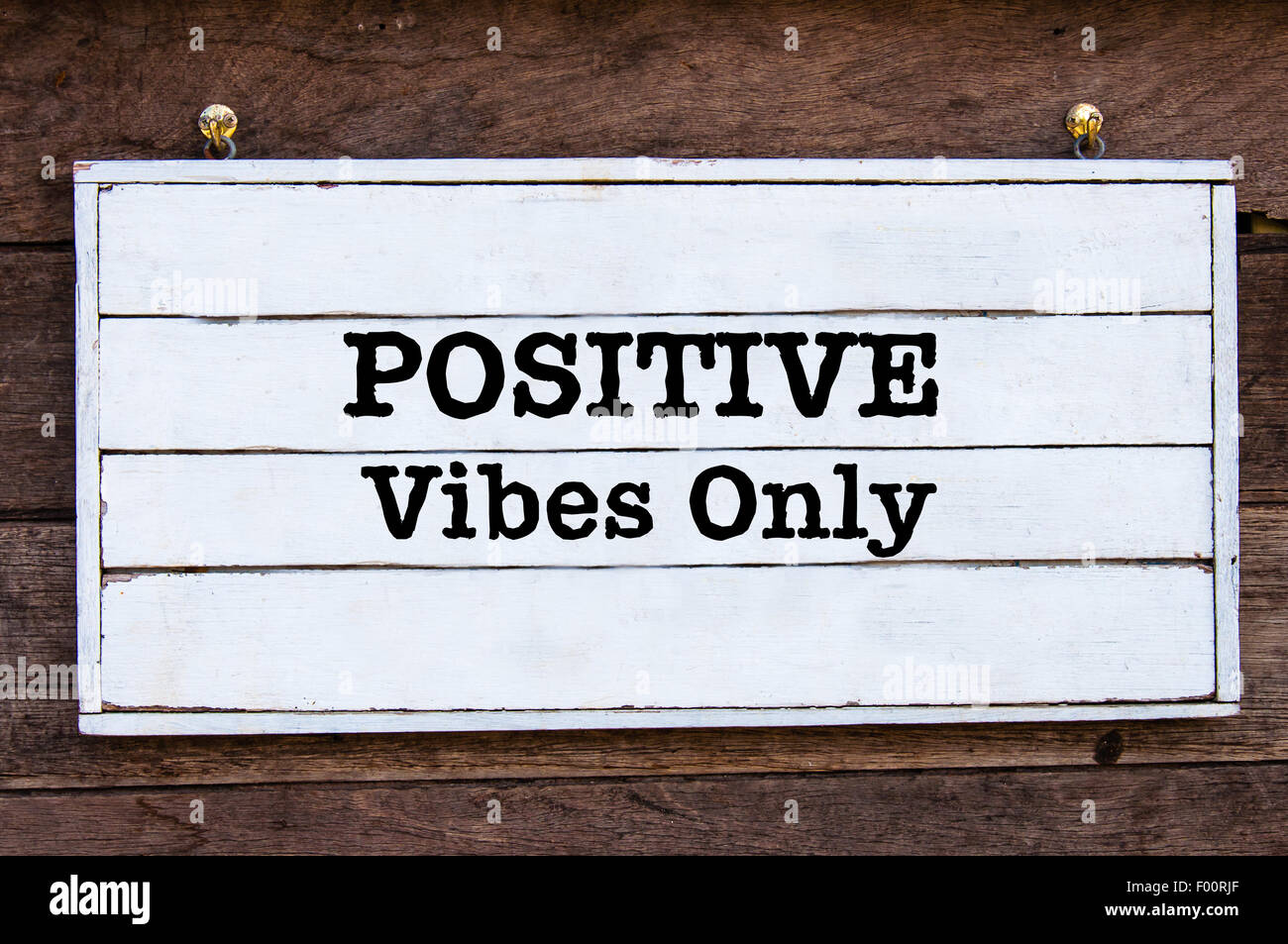 Positive Vibes Only Inspirational message written on vintage wooden ...
