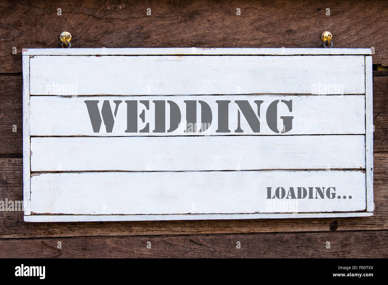 Wedding loading Inspirational message written on vintage wooden board ...