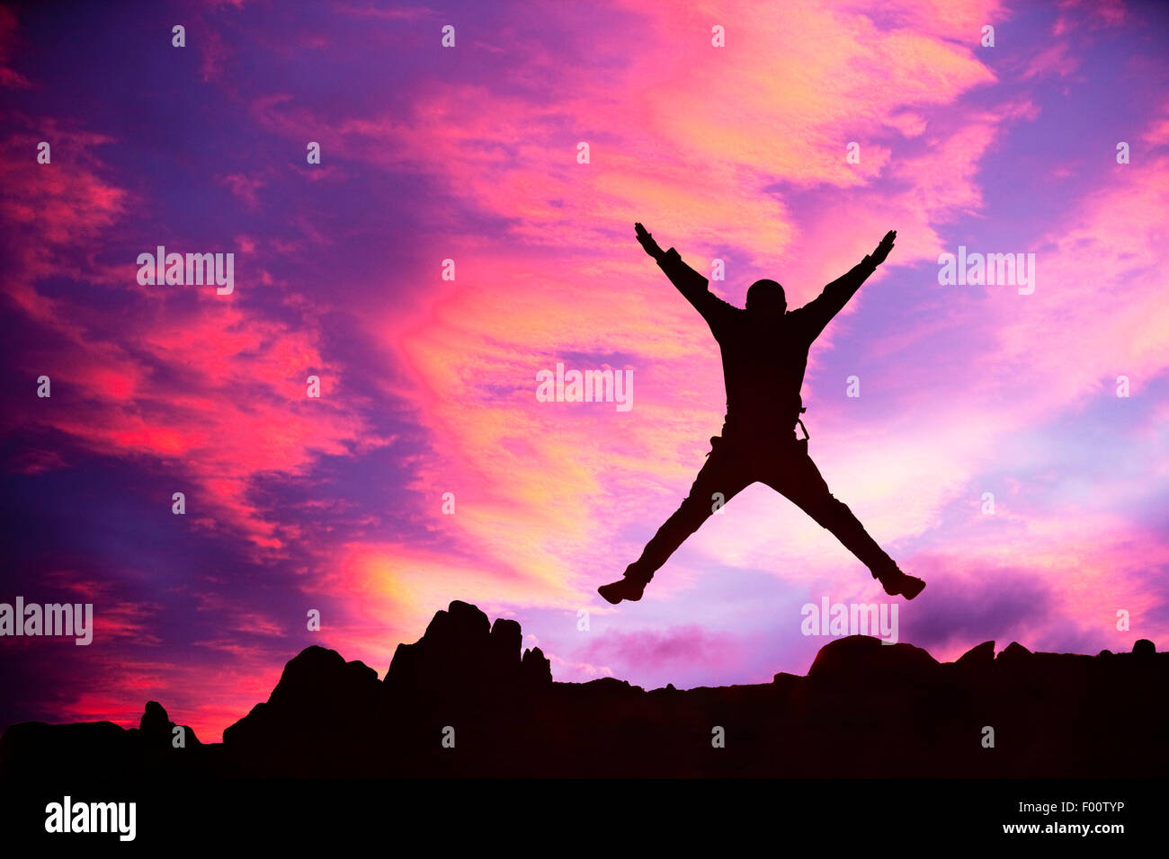 Silhouette of a man jumping at sunset hi-res stock photography and ...