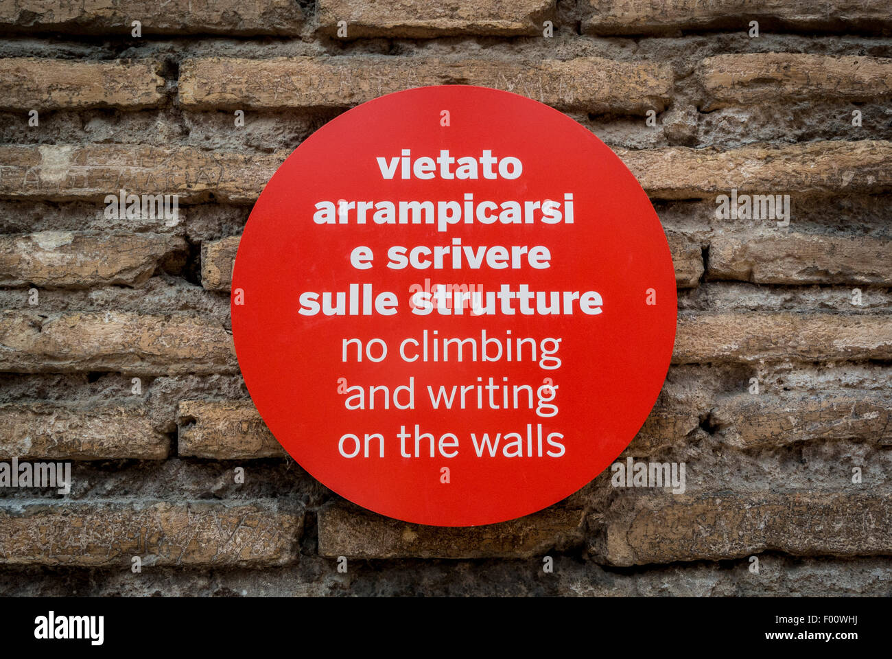 Sign on Colosseum wall. No climbing and writing on the walls Stock ...