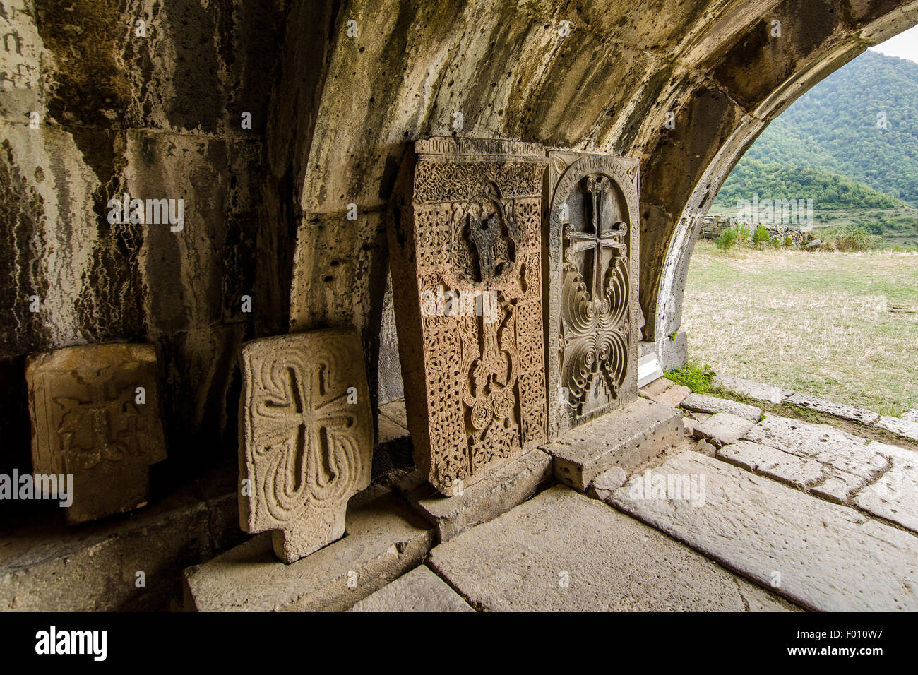 Historic carvings displayed in an ancient stone structure located in a ...