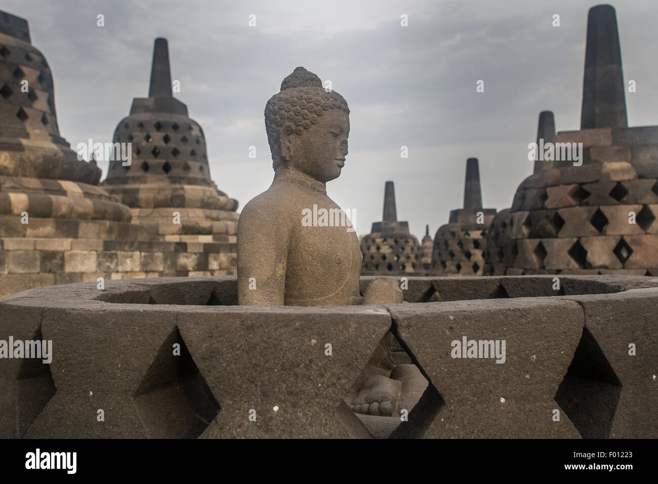 Statue of the Buddha at the 9th-century Buddhist temple, Borobudur, of ...