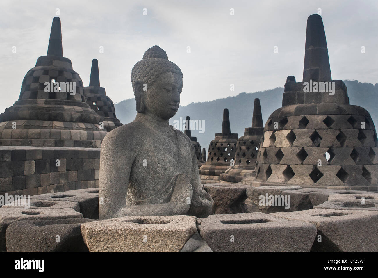 Statue of the Buddha at the 9th-century Buddhist temple, Borobudur, of ...