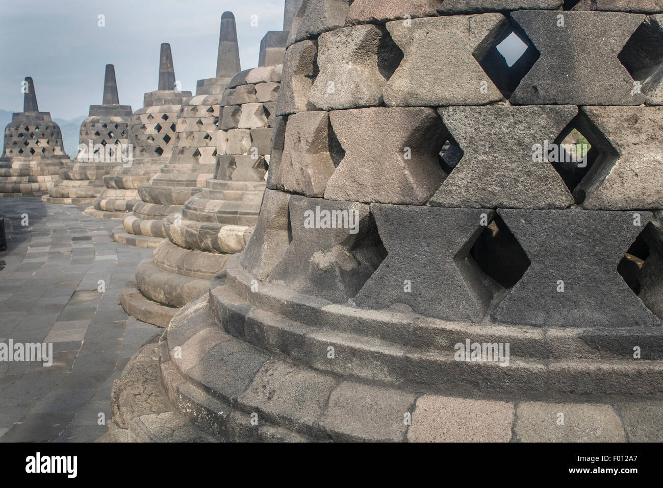 Stupas at the 9th-century Buddhist temple, Borobudur, of Java ...