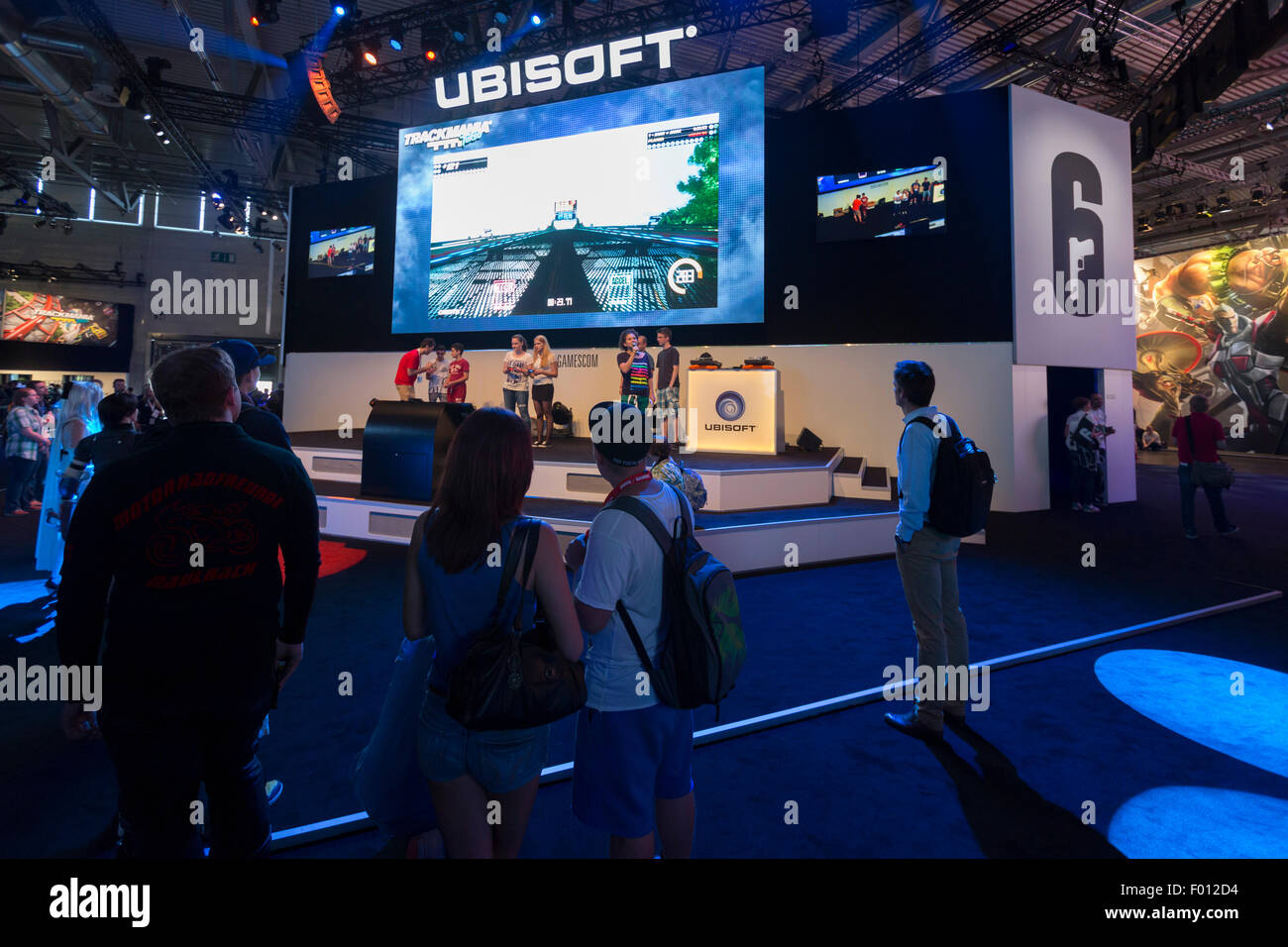 Cologne, Germany. 05th Aug, 2015. Visitors at the Ubisoft booth at the ...