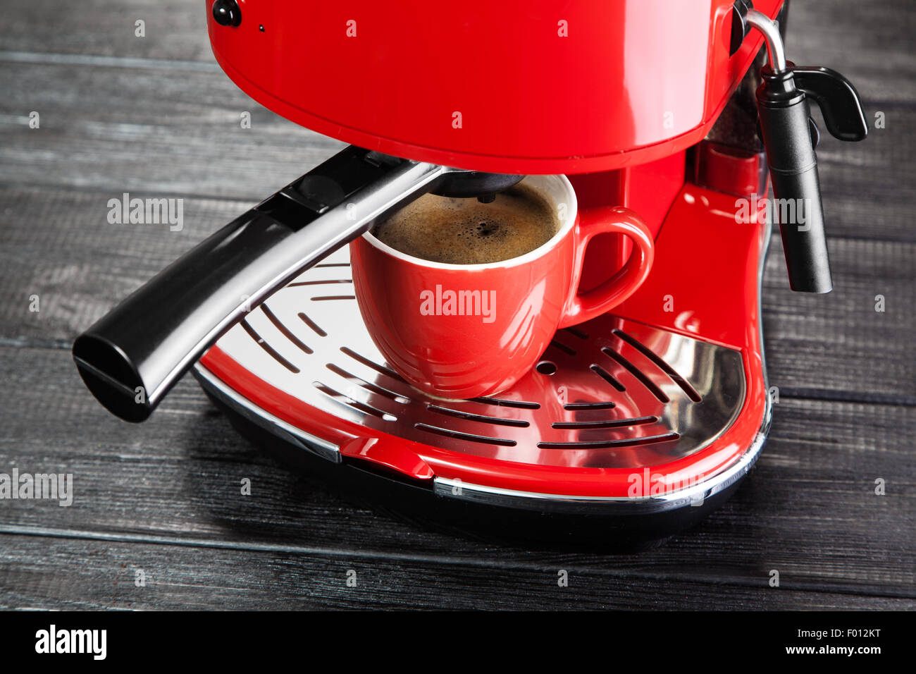 Red coffee machine Stock Photo - Alamy