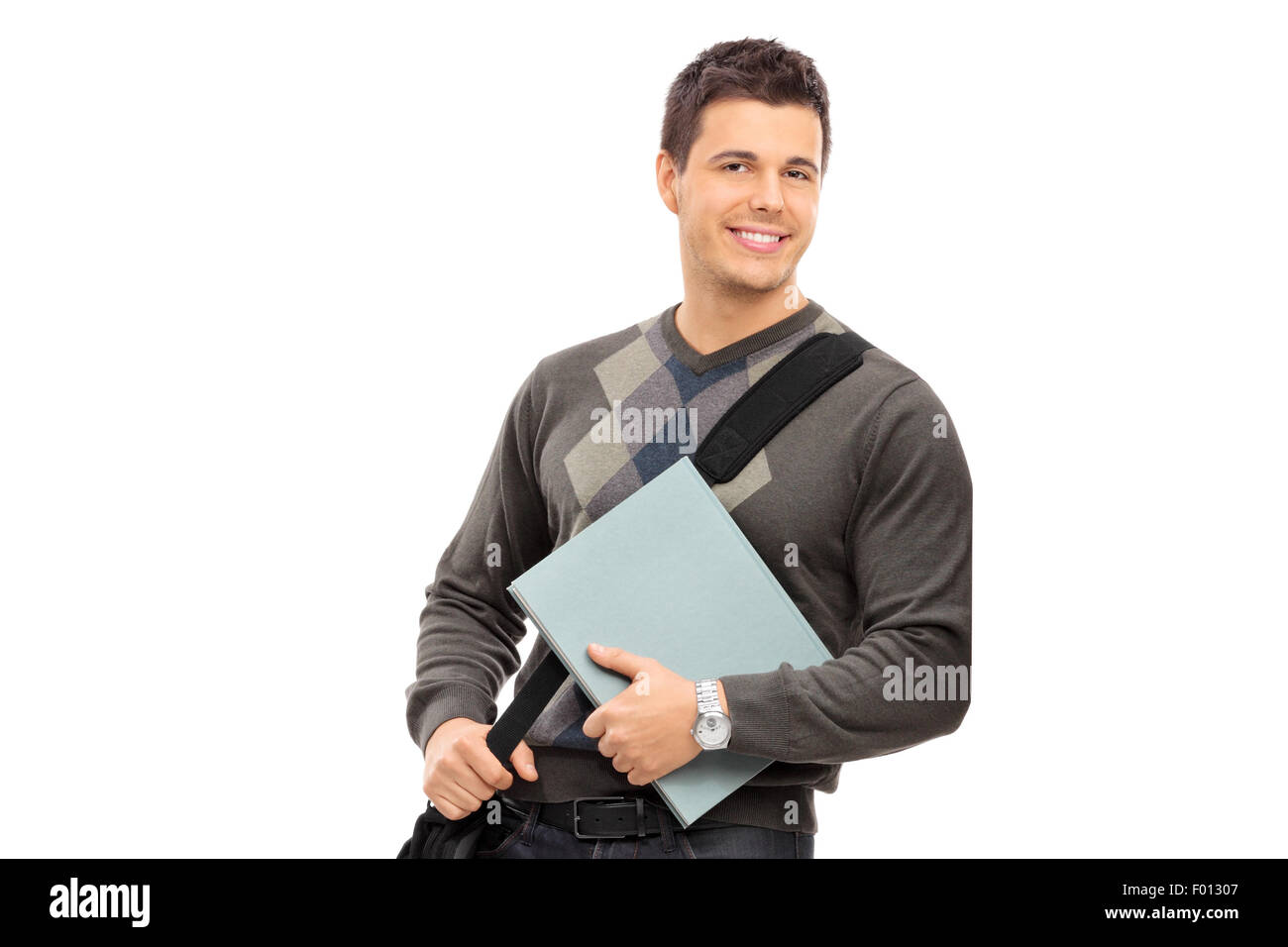 Young male student holding a notebook isolated on white background ...