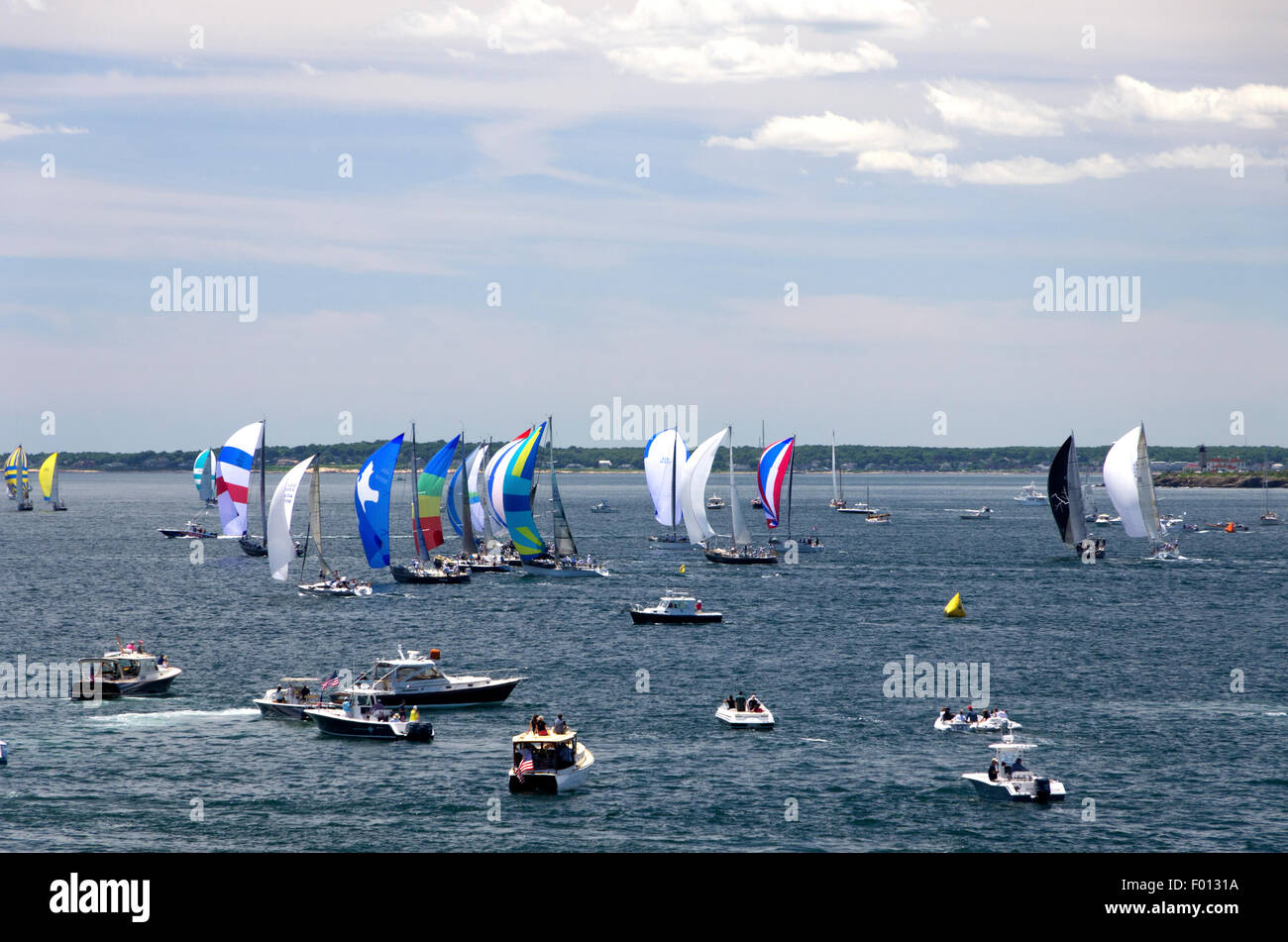 Fleet of yachts take off on a spinnaker run down wind from Newport, RI ...