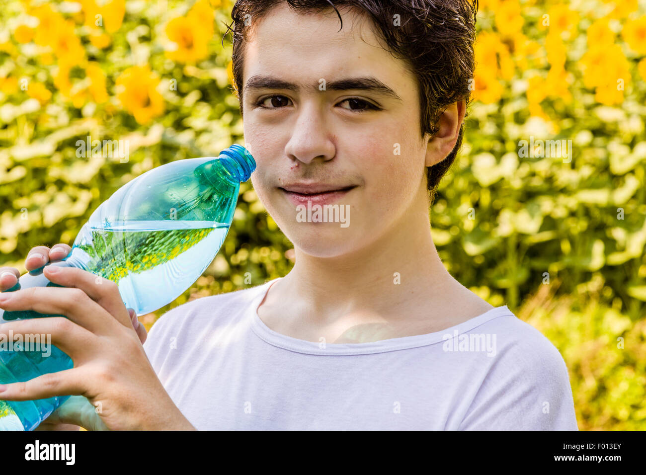 Environmentally-friendly living - Caucasian boy in a field of ...