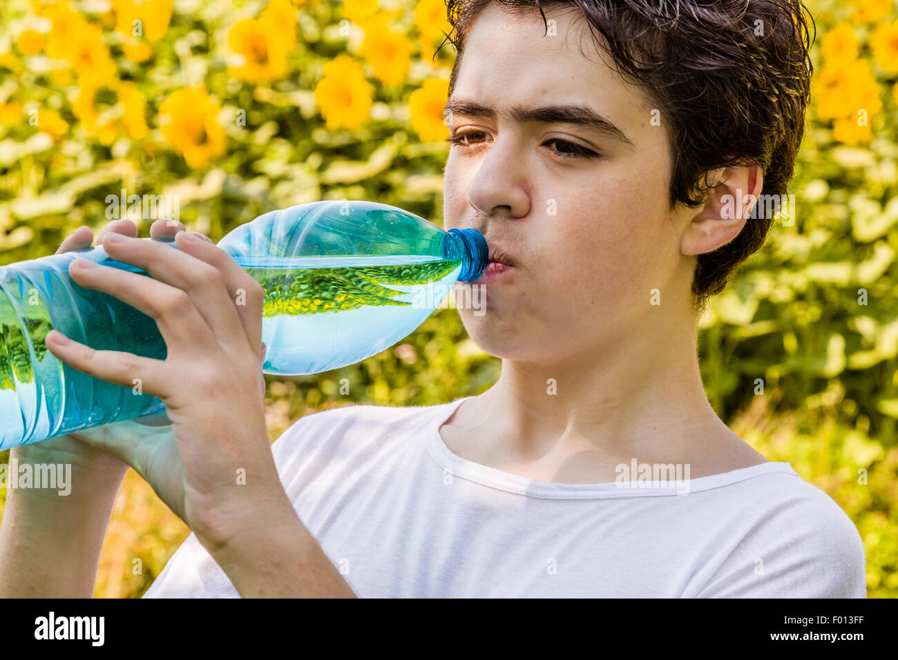 Environmentally-friendly living - Caucasian boy in a field of ...