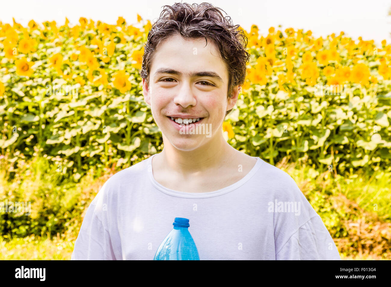 Environmentally-friendly living - Caucasian boy in a field of ...