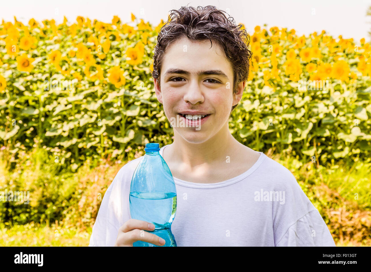 Environmentally-friendly living - Caucasian boy in a field of ...