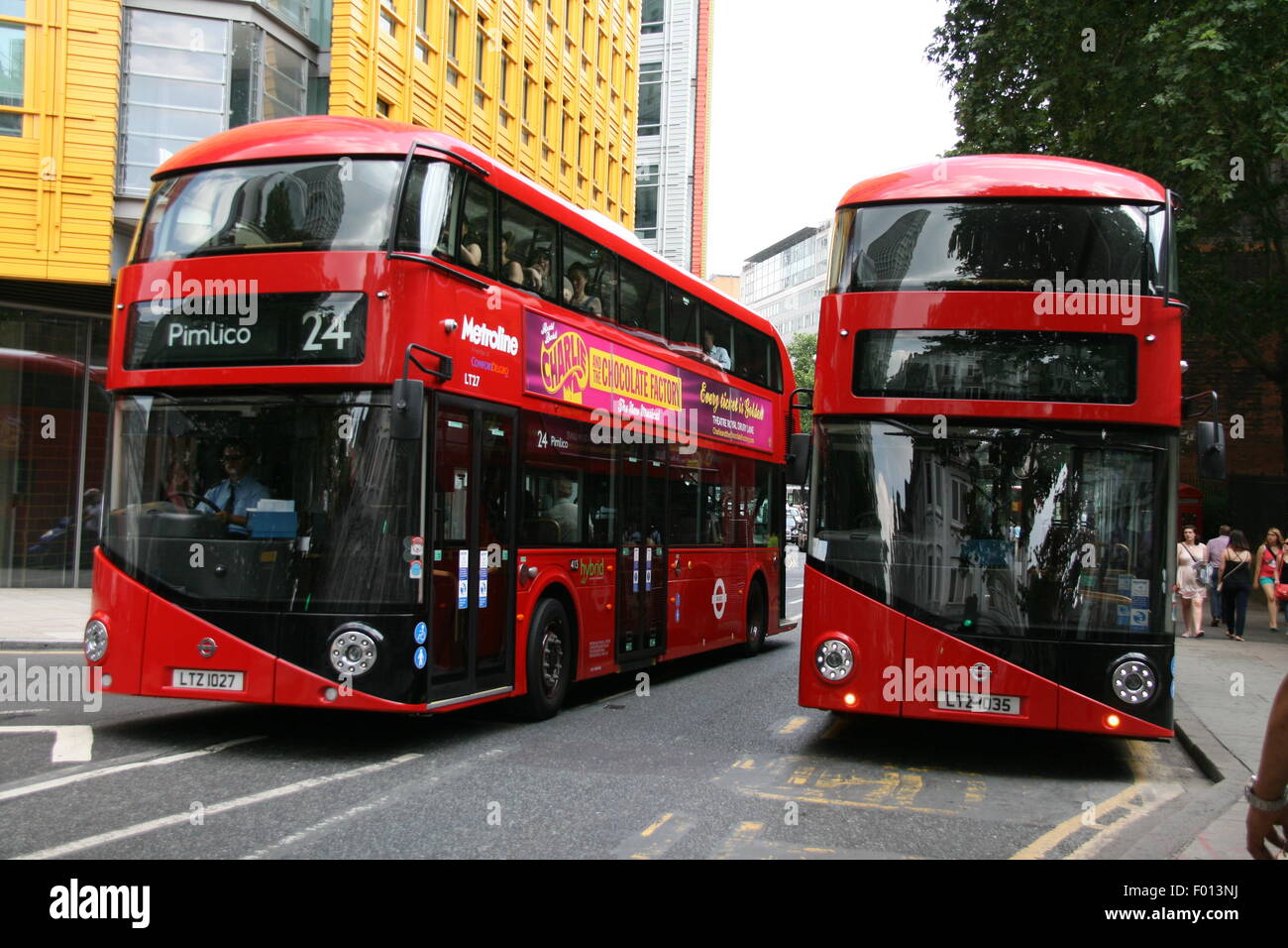 TWO RED LONDON NEW ROUTEMASTER BUSES PICTURED TOGETHER Stock Photo - Alamy