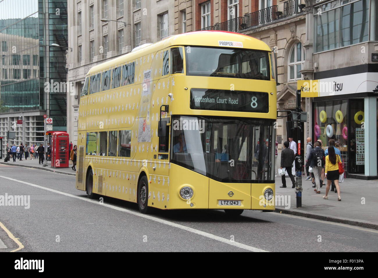 A New Routemaster London bus in a yellow advertising livery for proper ...
