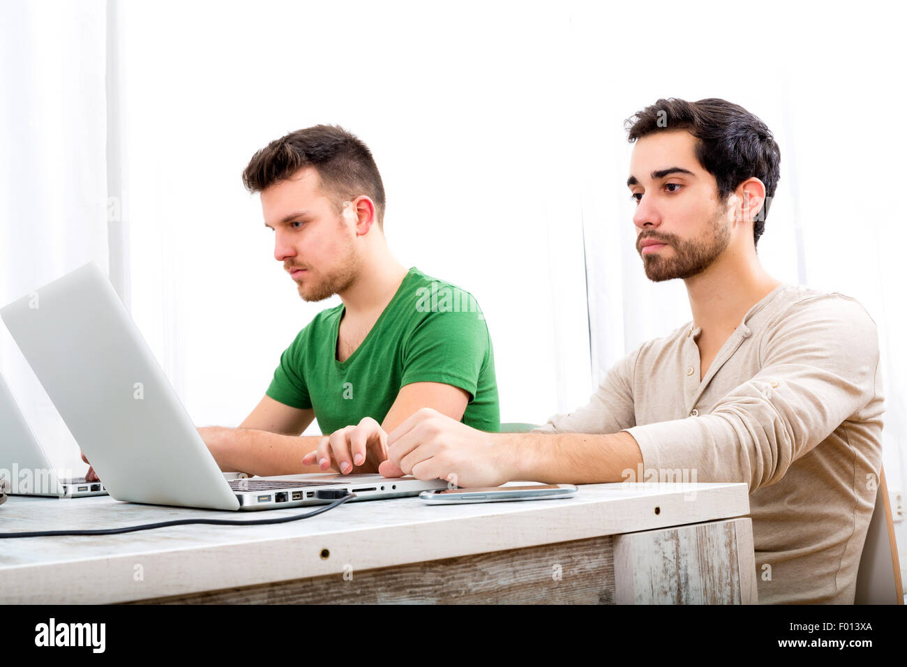 Two Friends starting up a company together Stock Photo - Alamy