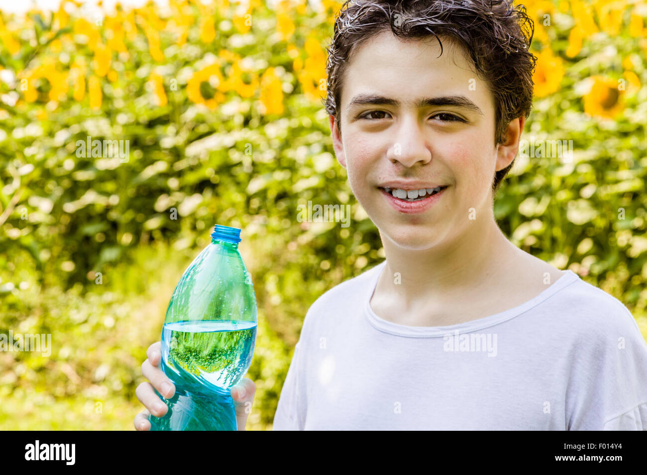Environmentally-friendly living - Caucasian boy in a field of ...