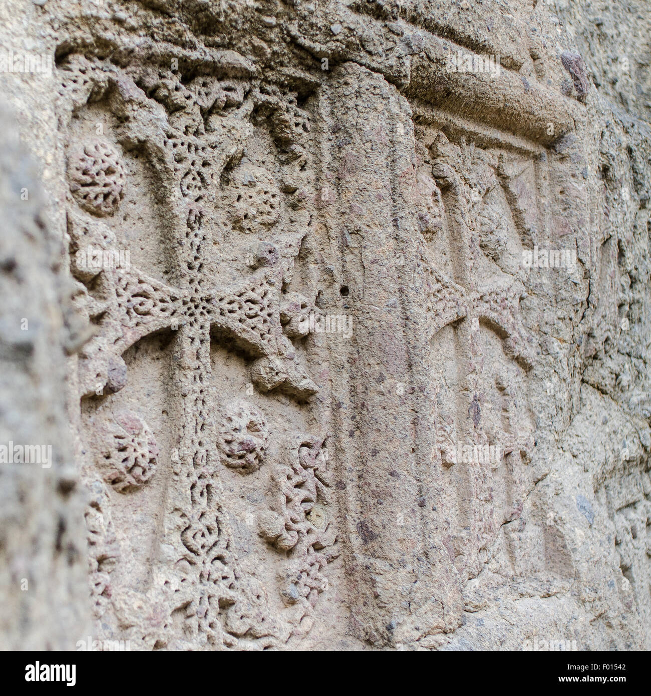 Historic carvings displayed in an ancient stone structure located in a ...