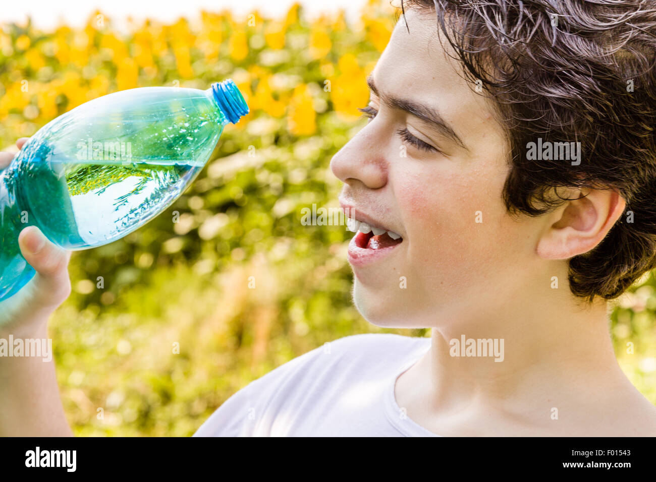 Environmentally-friendly living - Caucasian boy in a field of ...