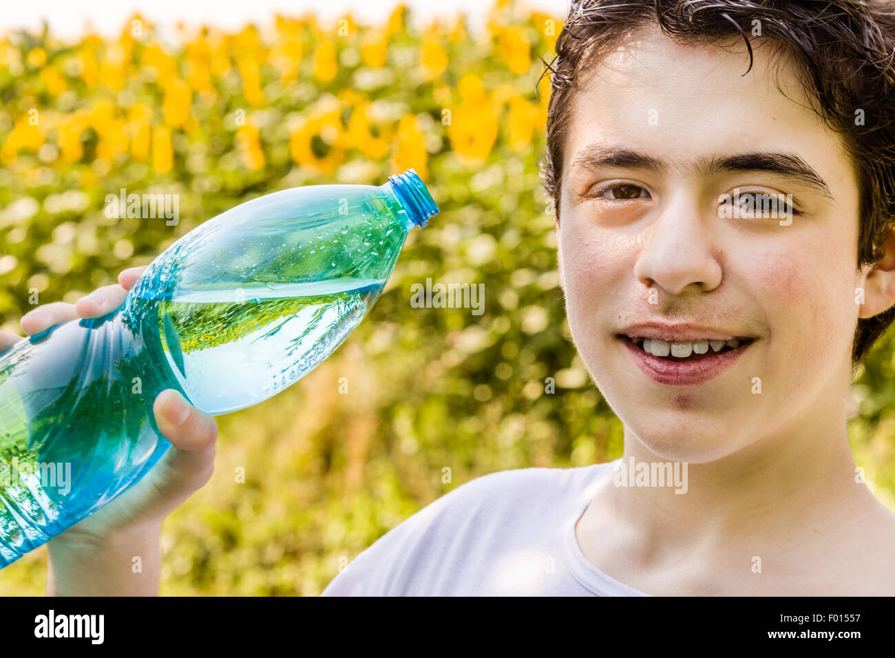 Environmentally-friendly living - Caucasian boy in a field of ...