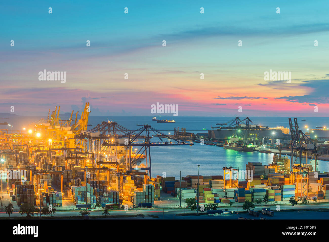 Container Cargo freight ship with working crane bridge in shipyard at ...