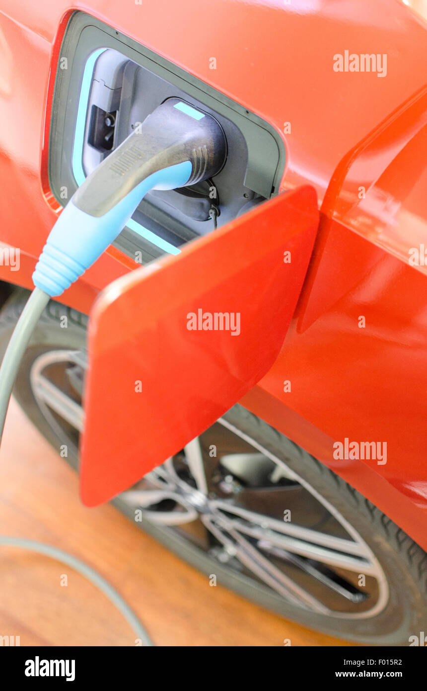 New modern car with eco friendly electric engine stands at the dock and ...