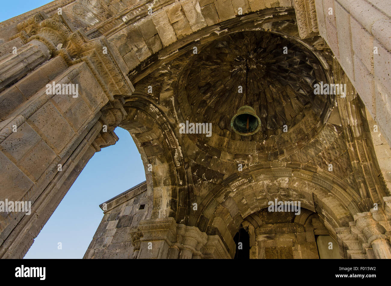 Historic stone monastery in a serene landscape under a clear blue sky ...