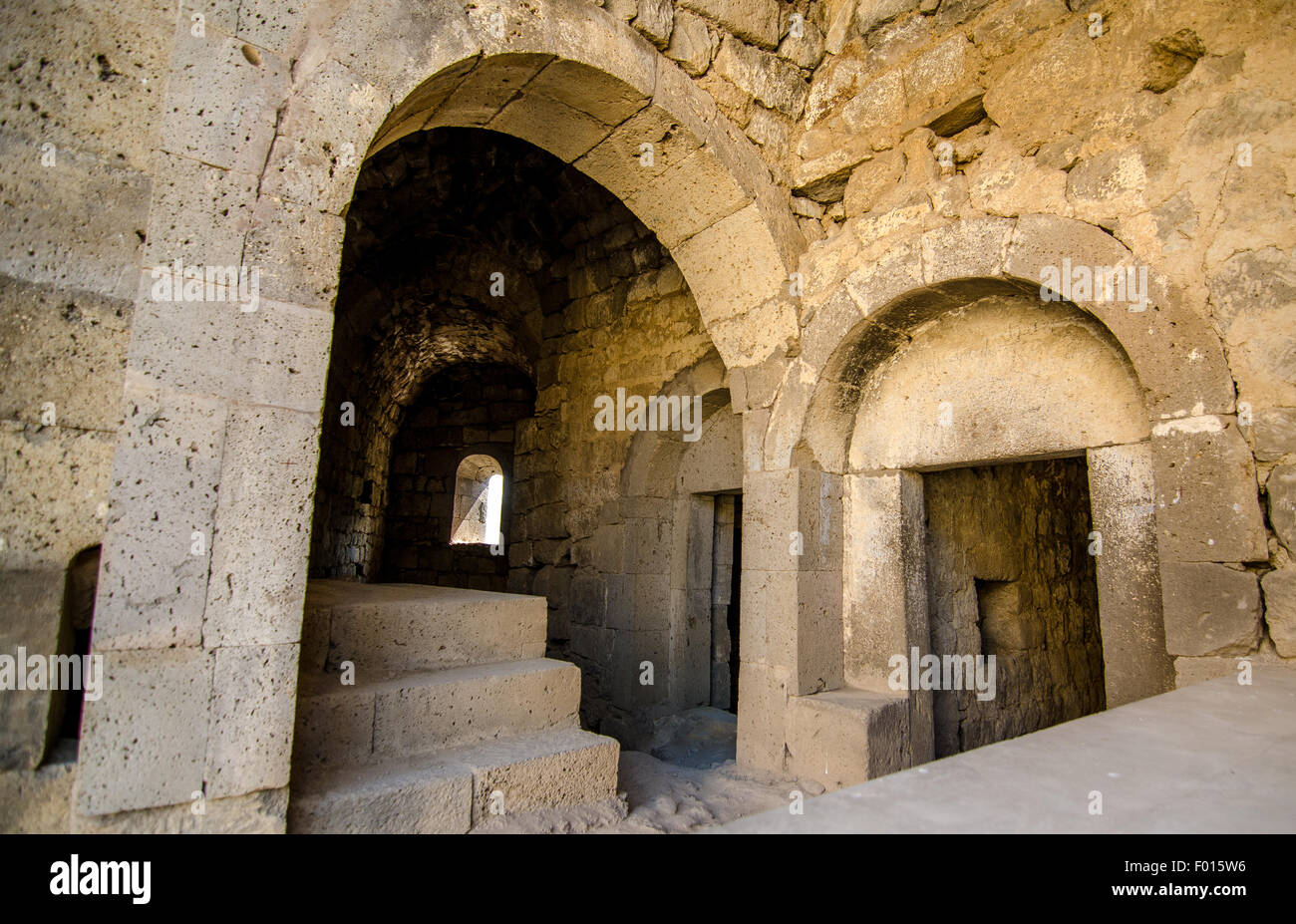 Historic stone monastery in a serene landscape under a clear blue sky ...