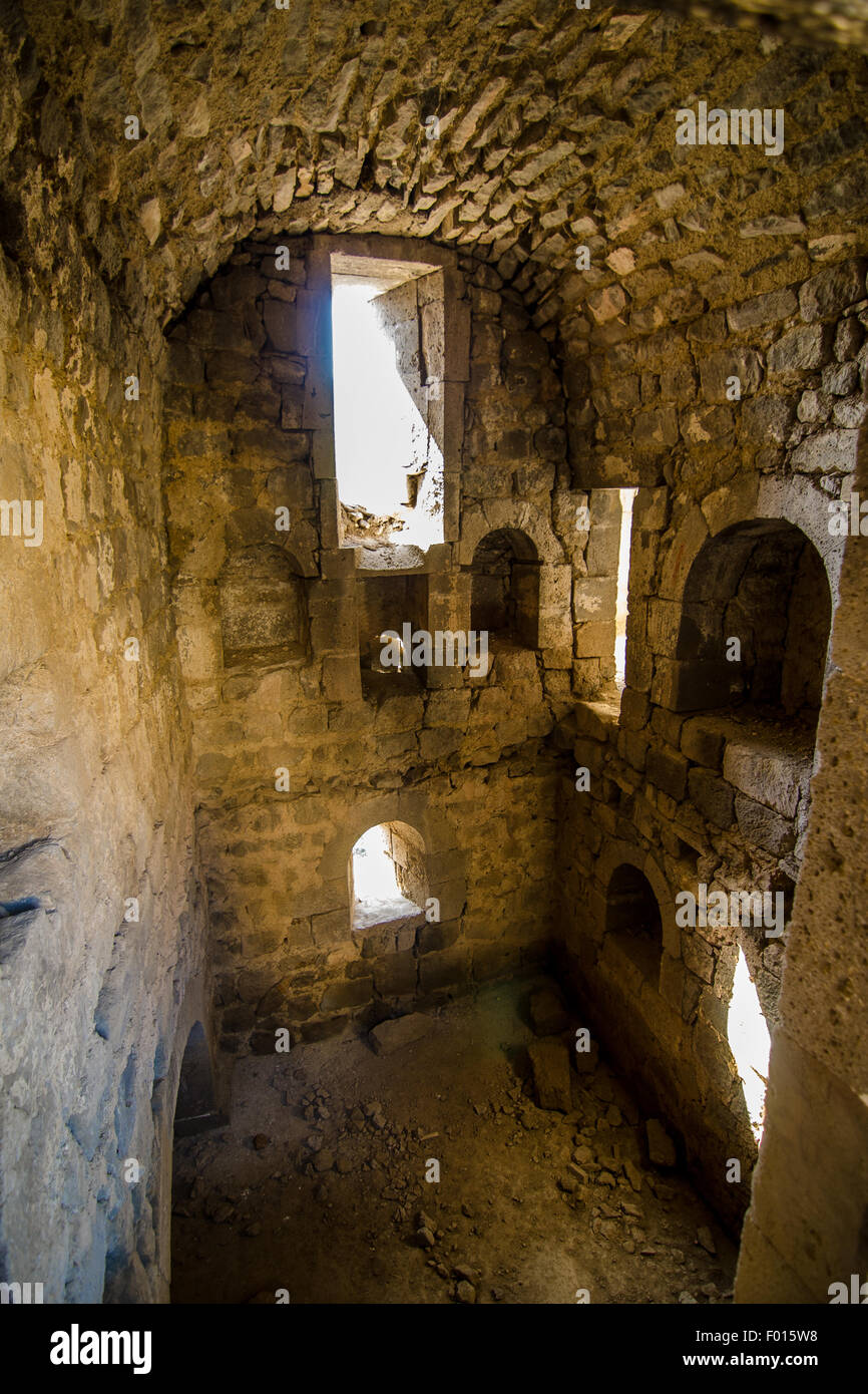 Historic stone room in an ancient building with arched windows and ...